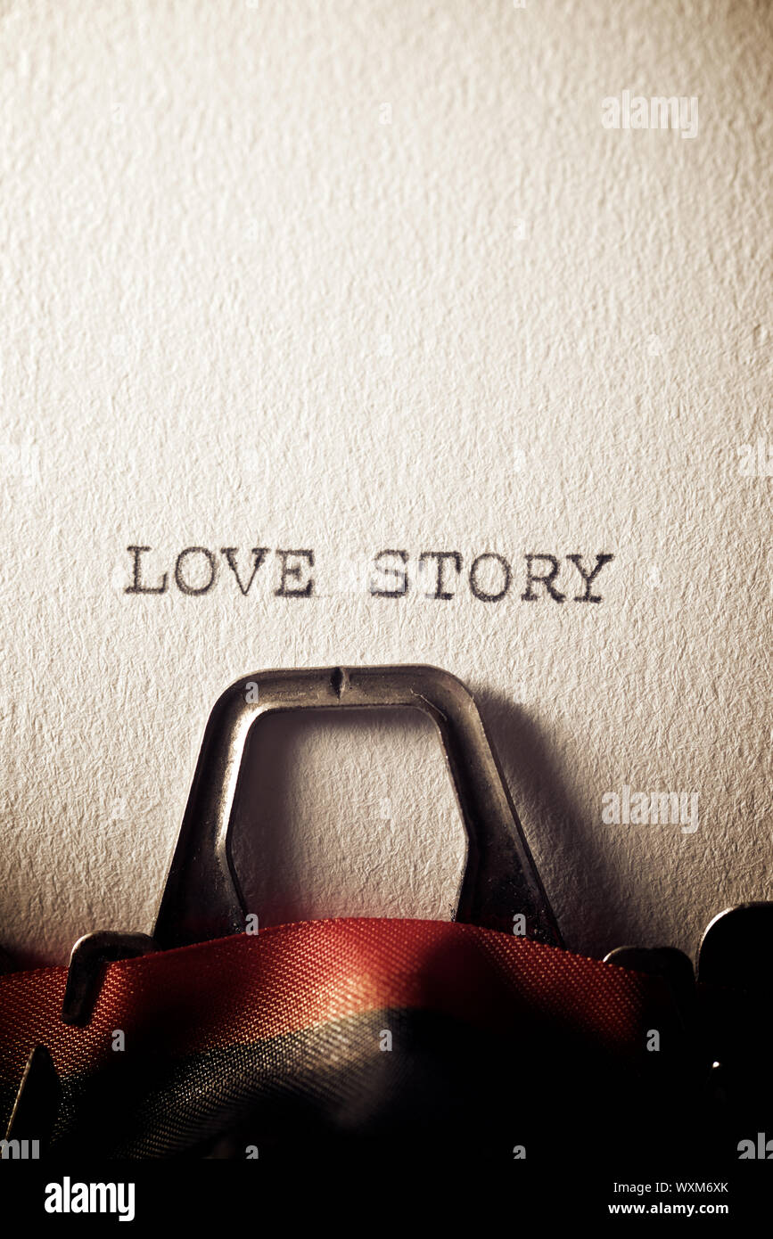 The sentence, Love Story, written with a typewriter Stock Photo - Alamy