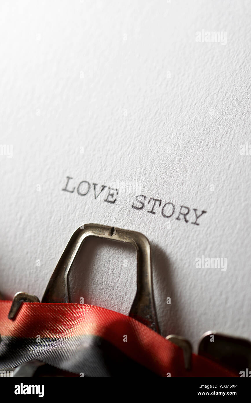 The sentence, Love Story, written with a typewriter Stock Photo - Alamy