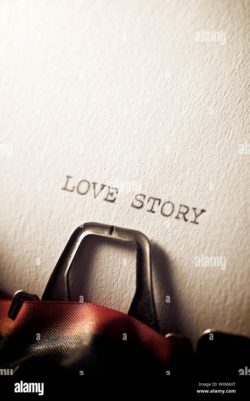 The sentence, Love Story, written with a typewriter Stock Photo - Alamy