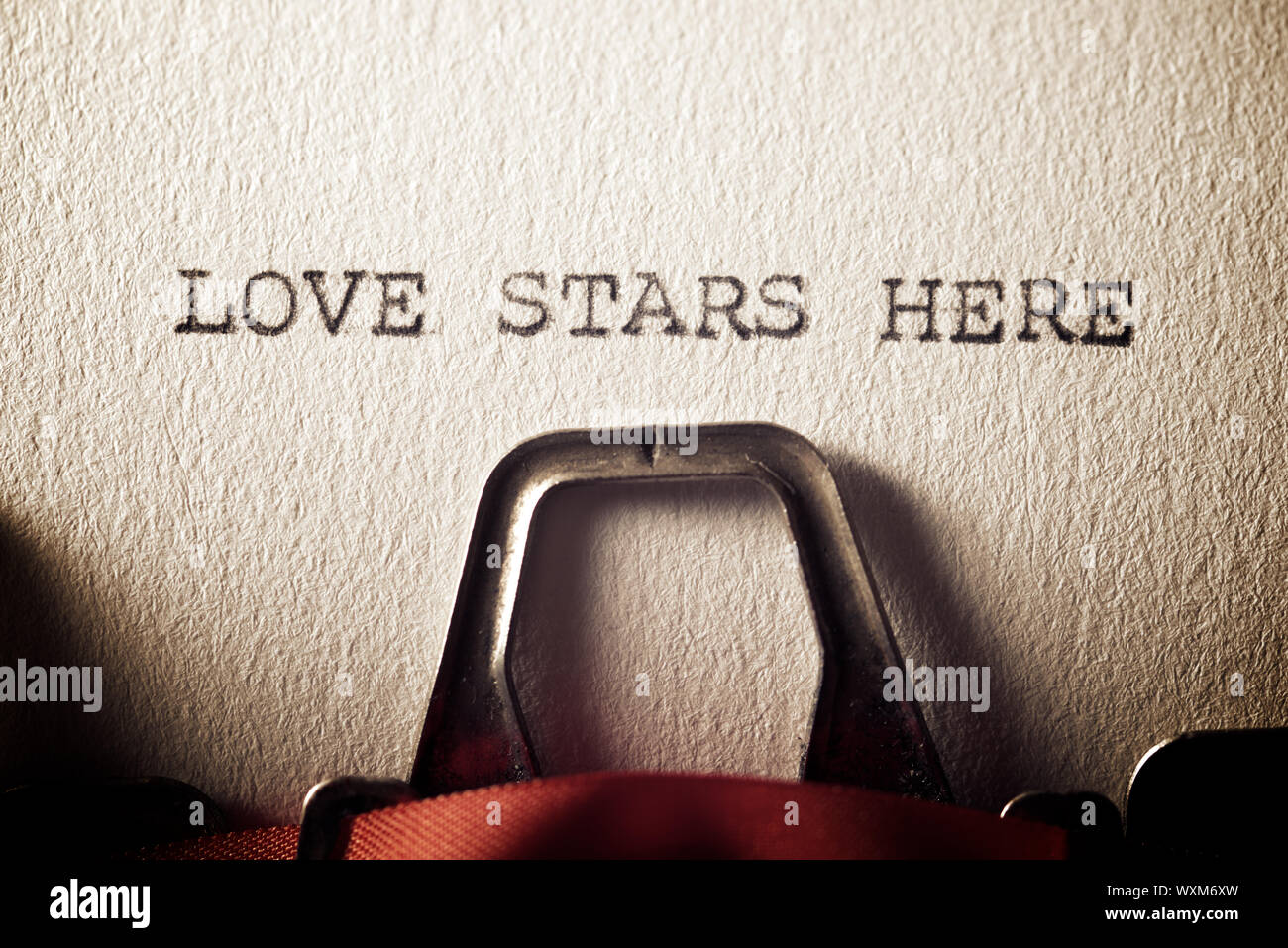 The sentence, Love Stars Here, written with a typewriter Stock Photo ...