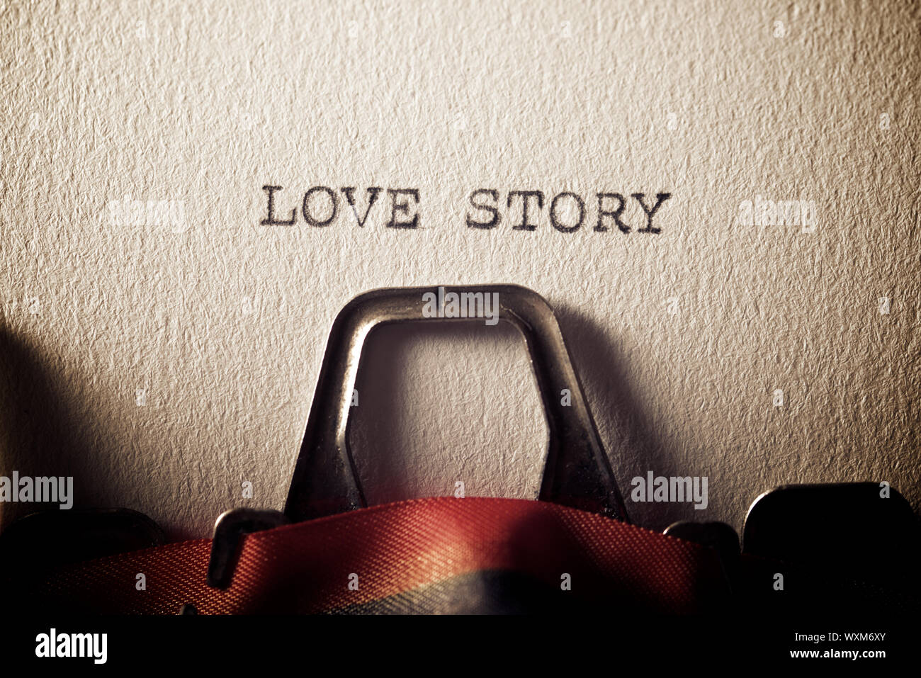 The sentence, Love Story, written with a typewriter Stock Photo - Alamy