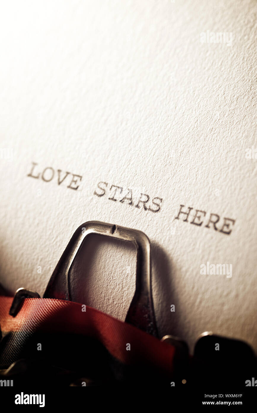 The sentence, Love Stars Here, written with a typewriter Stock Photo ...
