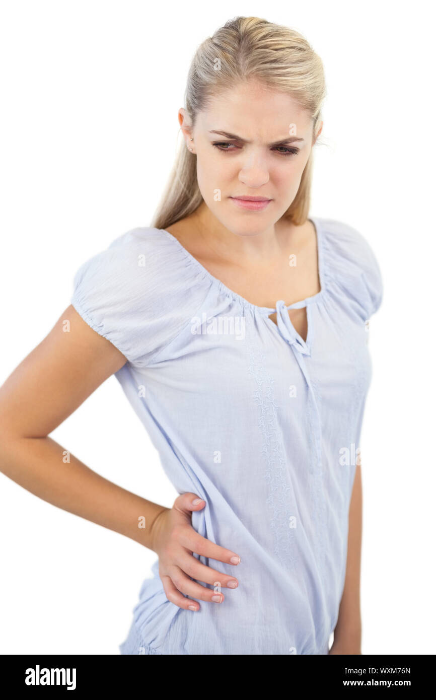 Blonde woman has a bad lower back on white background Stock Photo - Alamy