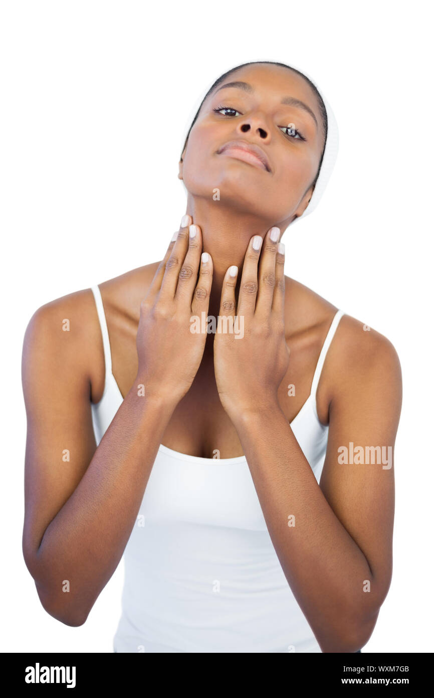 Woman touching her neck on white background Stock Photo - Alamy