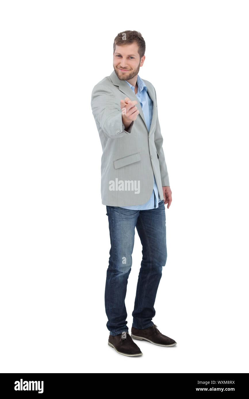 Trendy young model pointing to the camera on white background Stock ...