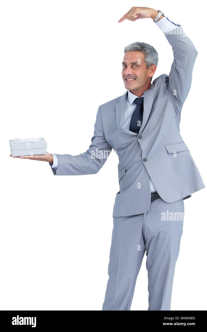 Funny businessman on white background offering gift Stock Photo - Alamy