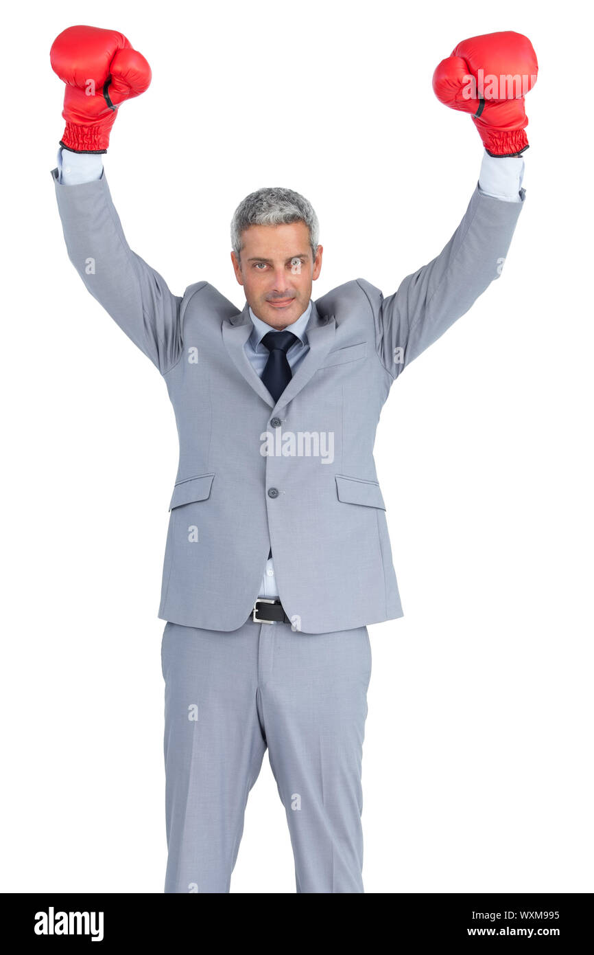 Businessman posing on white background with red boxing gloves hands up ...