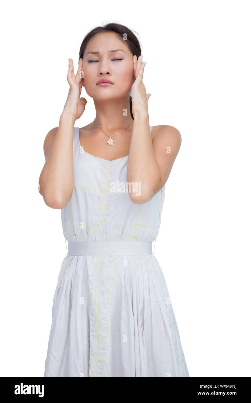 Concerned woman posing on white background Stock Photo - Alamy