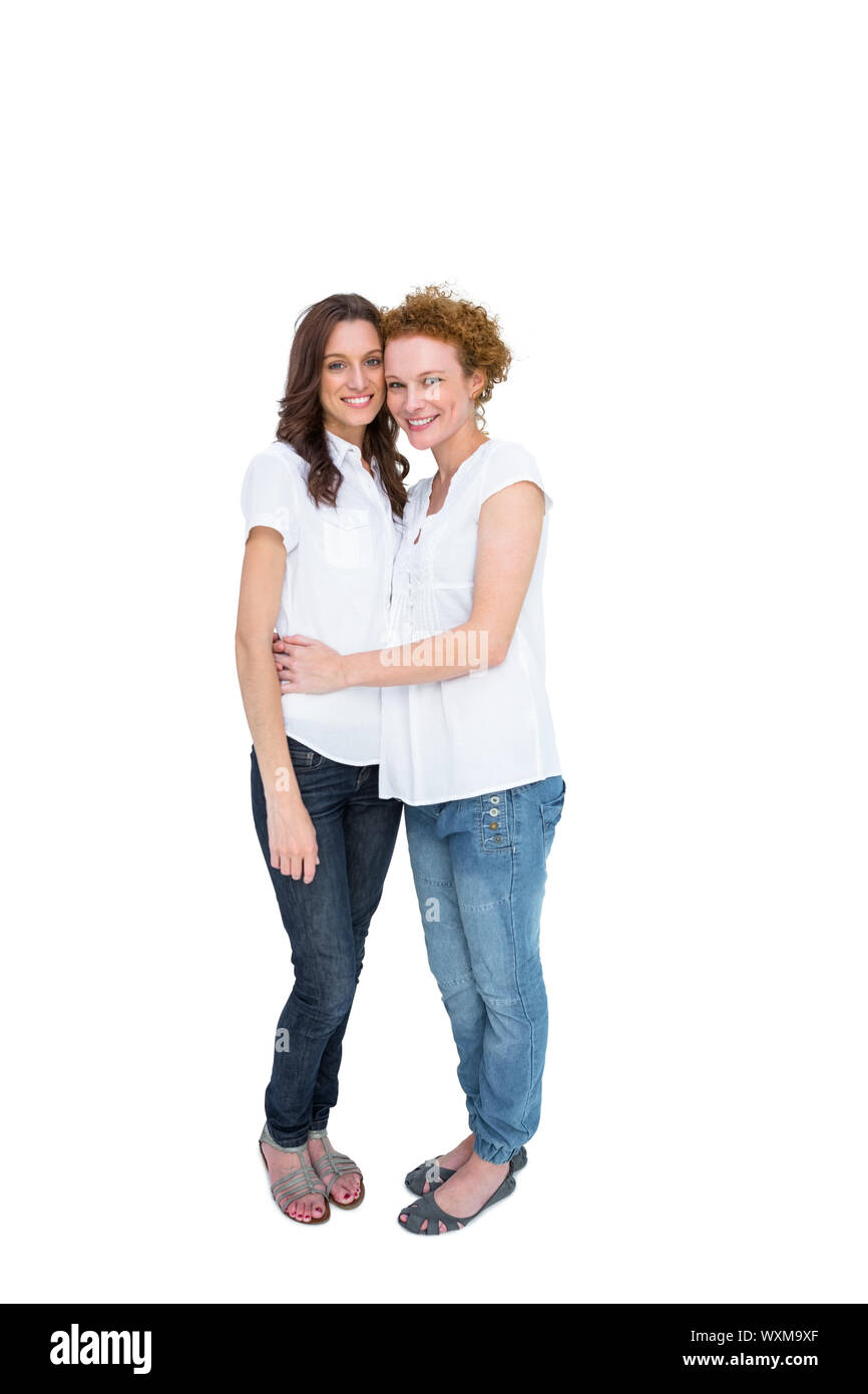 Two beautiful casual models posing on white background Stock Photo - Alamy