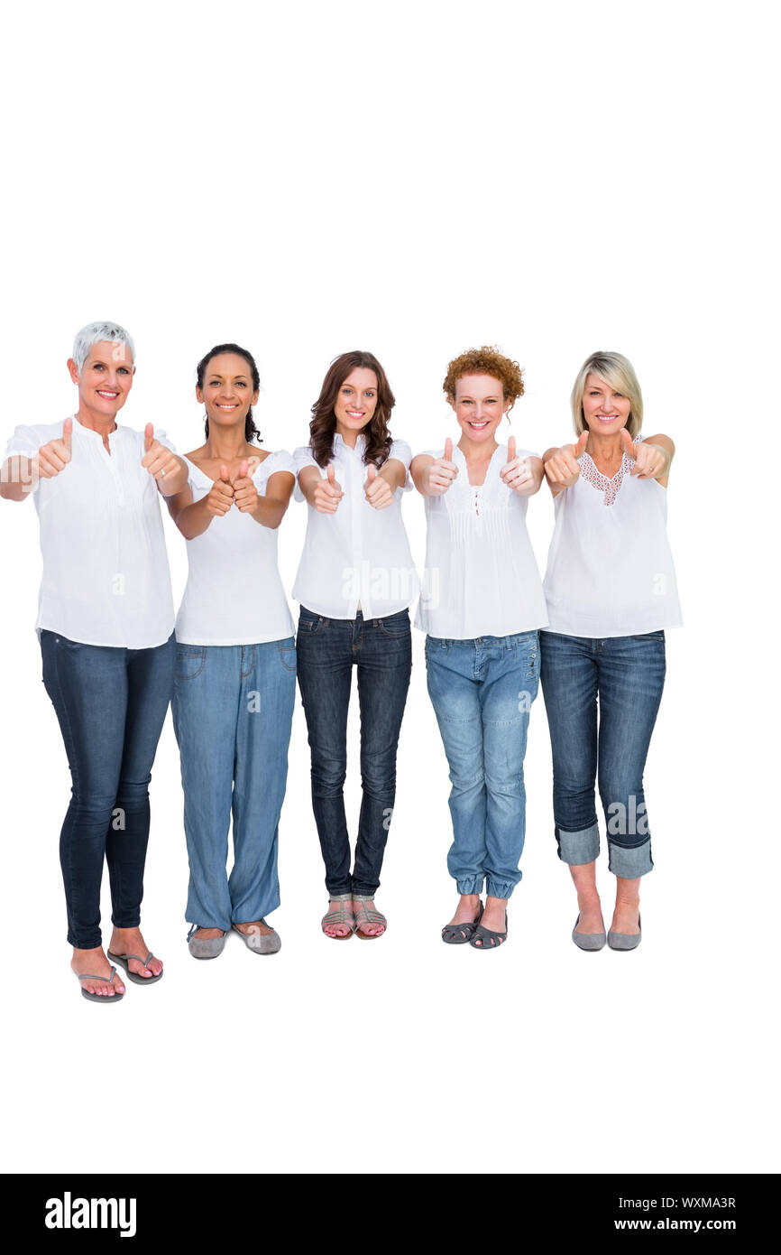 Cheerful casual models with thumbs up on white background Stock Photo ...