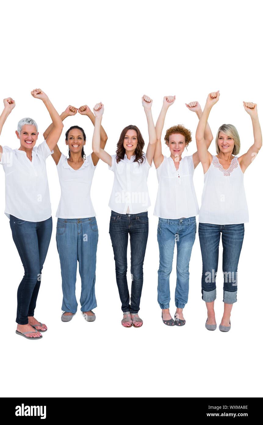 Cheerful casual models posing with hands up on white background Stock ...