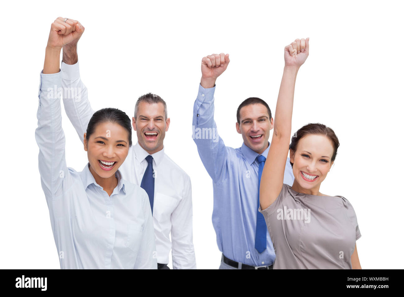 Cheerful work team posing with hands up on white background Stock Photo ...