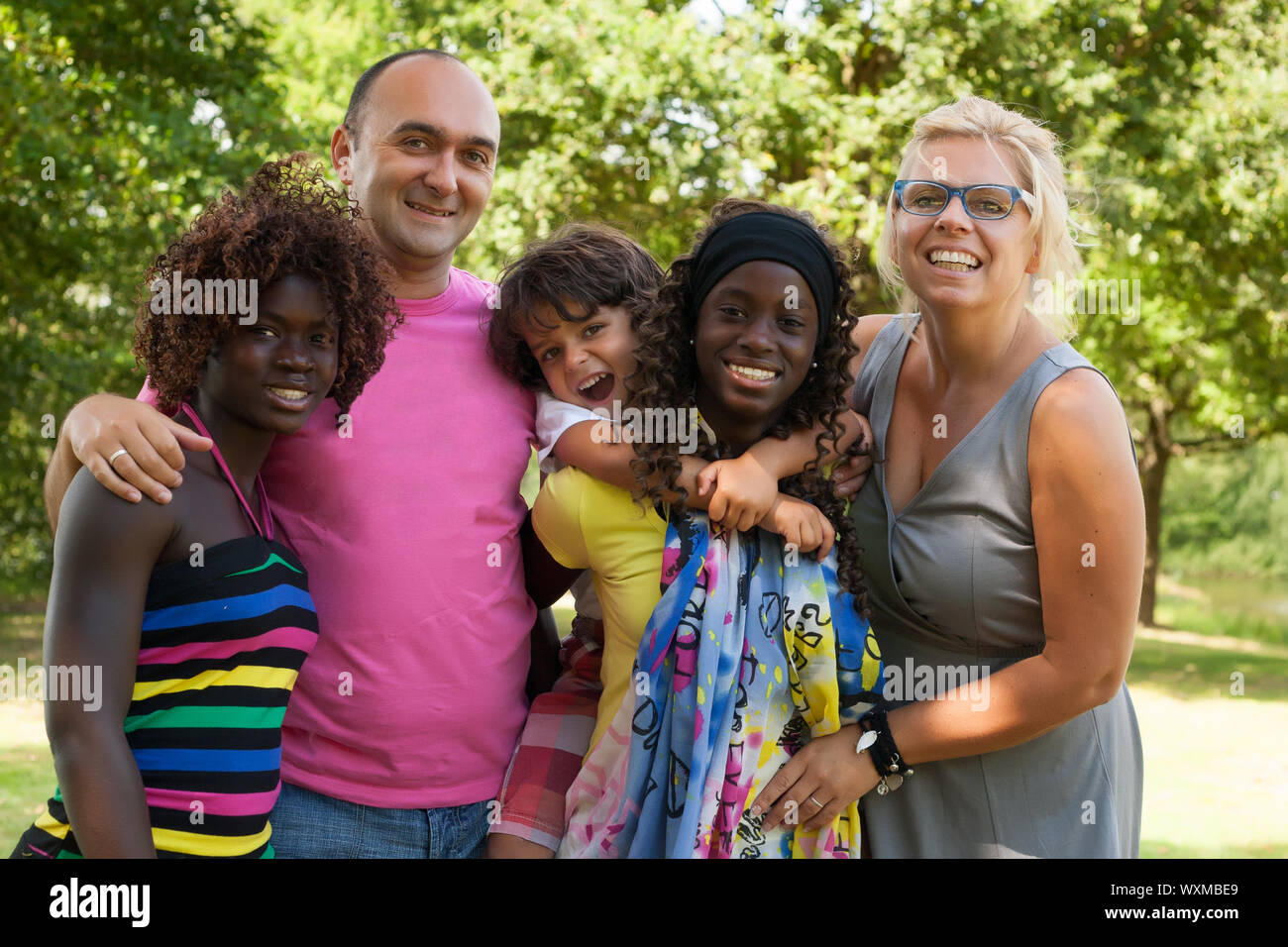 Happy multicultural family having a nice summer day Stock Photo - Alamy
