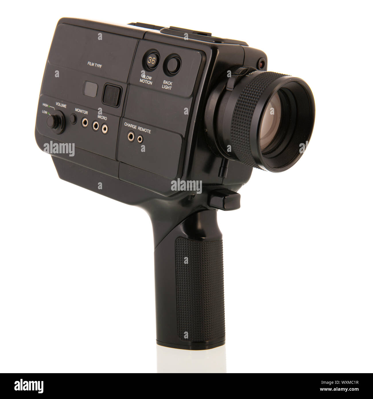 Old film camera for celluloid movie isolated over white background ...