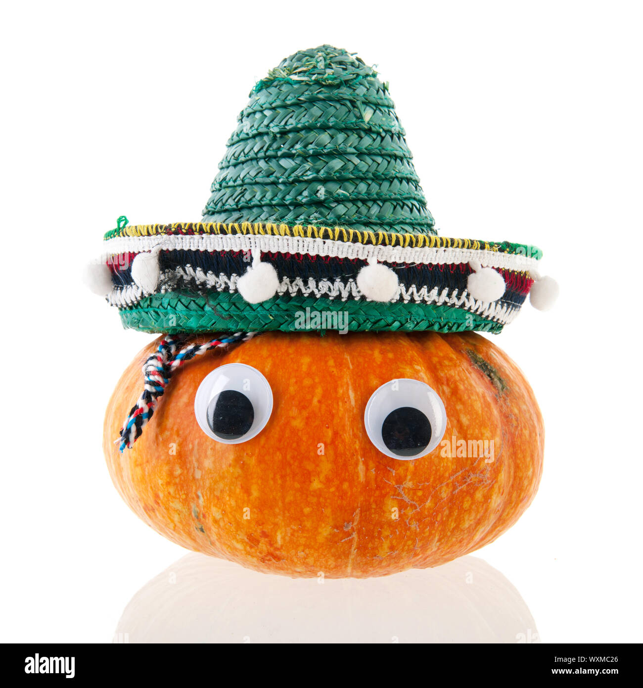 Spanish whole pumpkin with eyes isolated over white background Stock ...