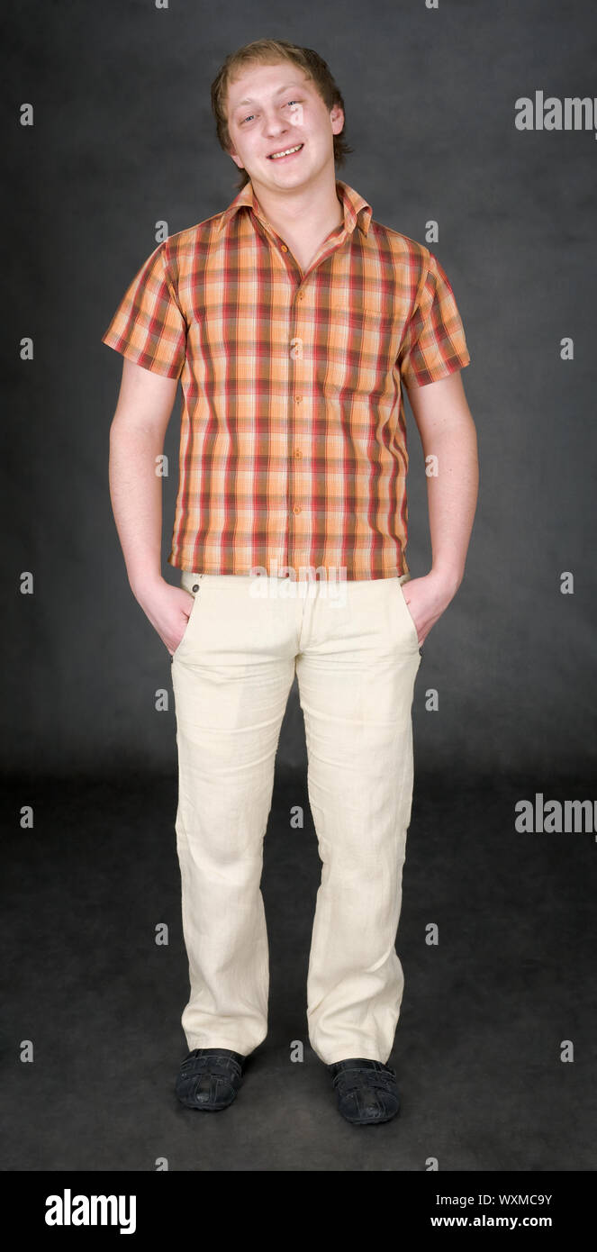 Portrait smug guy on the black background Stock Photo - Alamy