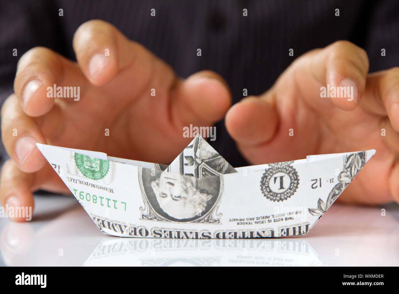 origami paper sailboat, money concept Stock Photo - Alamy