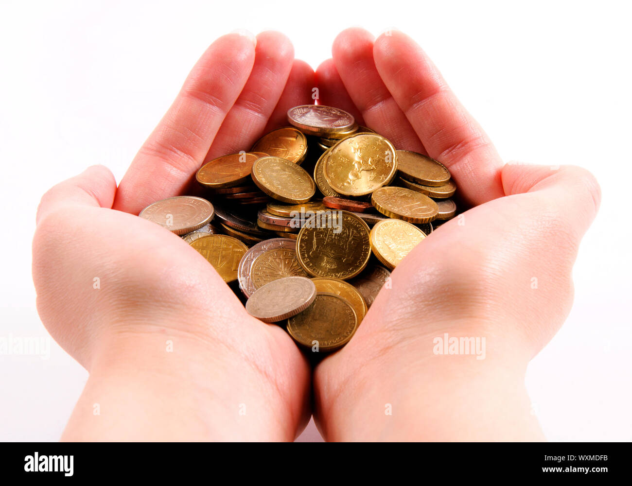 Female hands holding coins Stock Photo - Alamy
