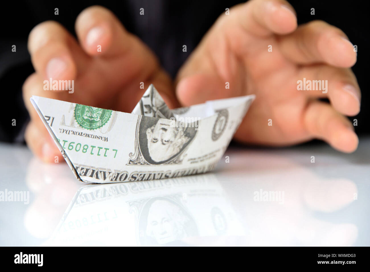 origami paper sailboat, money concept Stock Photo - Alamy