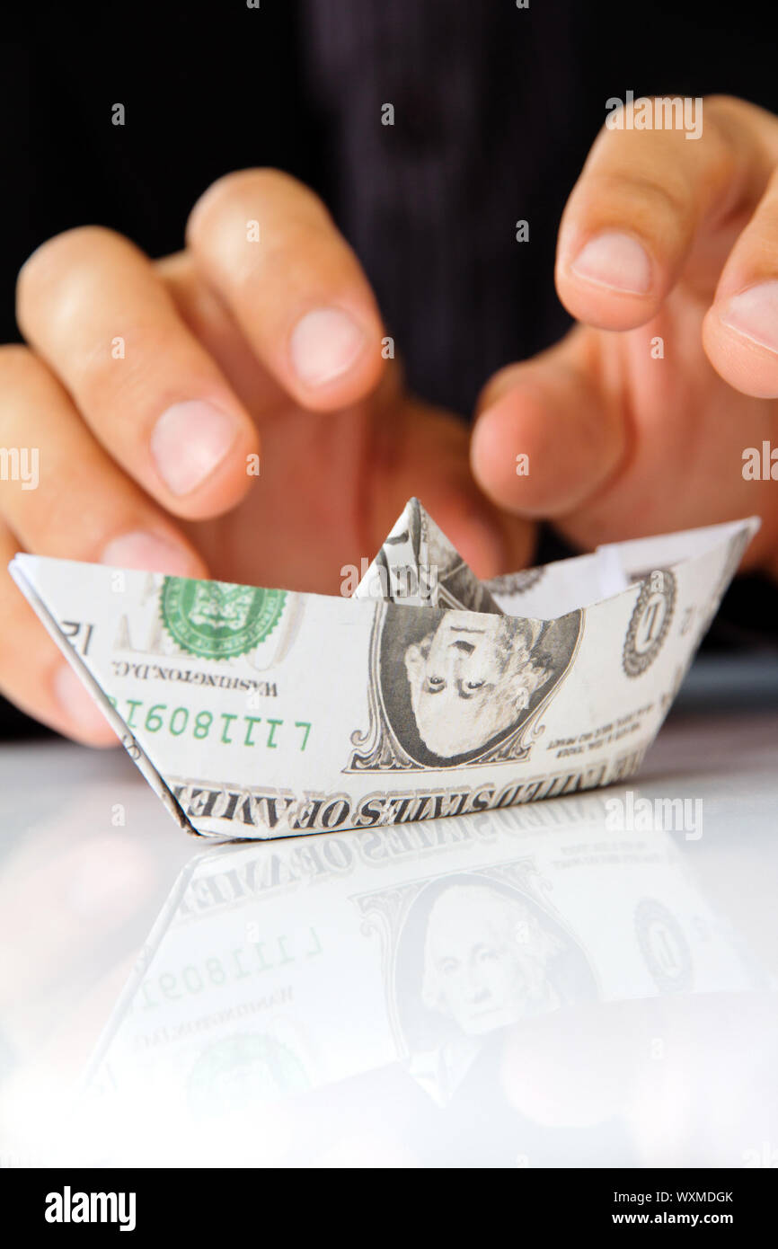 origami paper sailboat, money concept Stock Photo - Alamy