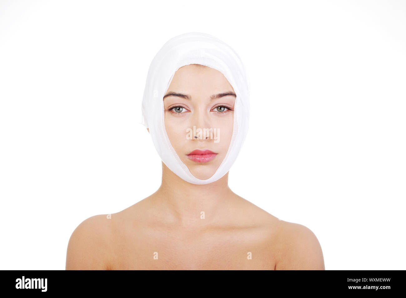 portrait of beautiful young female face with bandage - beauty treatment ...
