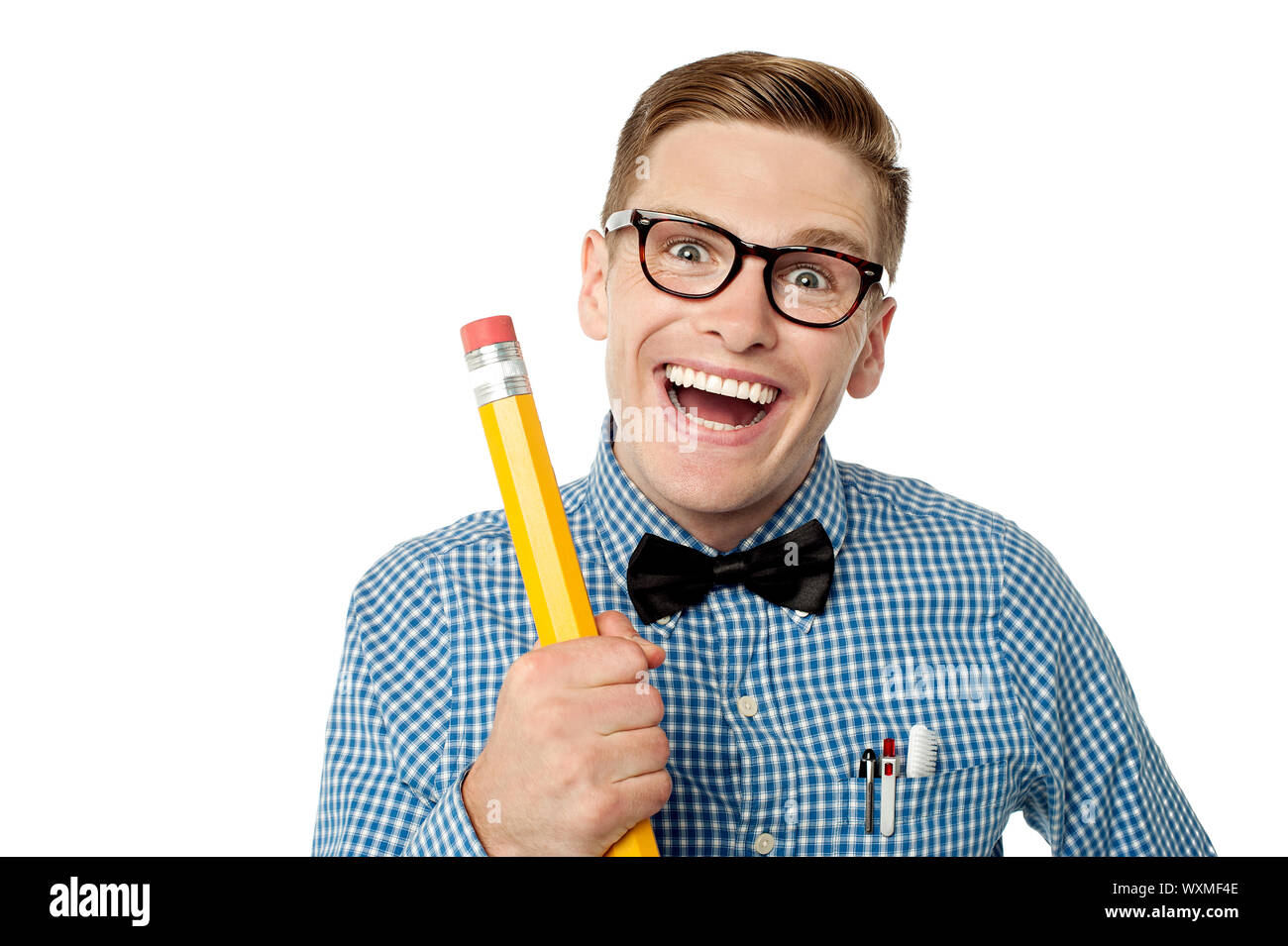 Mischievous student holding big yellow pencil Stock Photo - Alamy