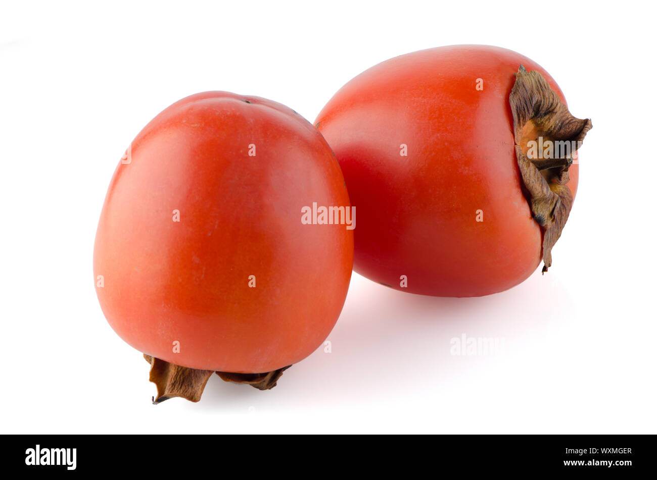 Red ripe persimmons isolated over white background Stock Photo - Alamy