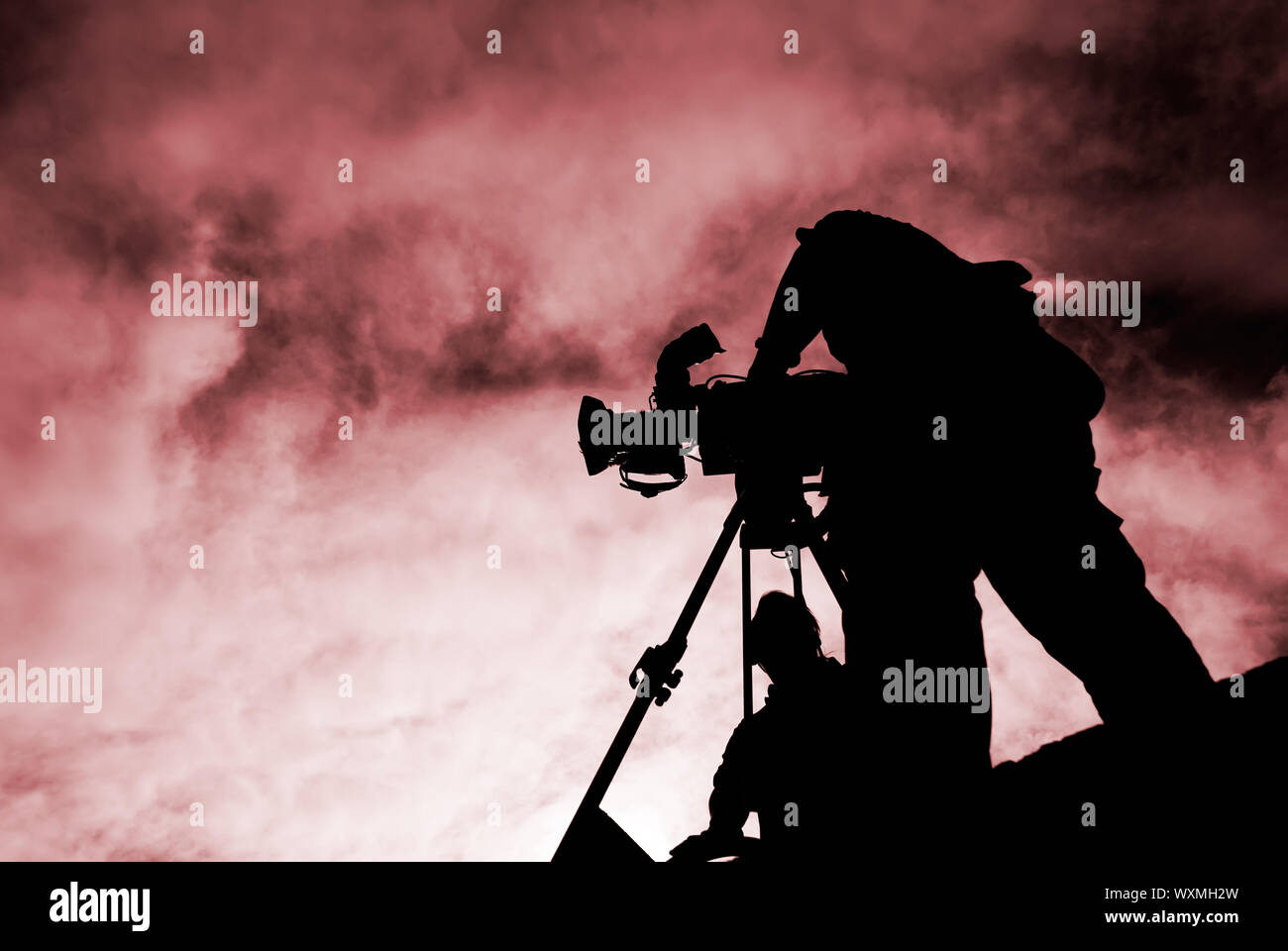 Here was a cameraman stand with silhouette Stock Photo - Alamy