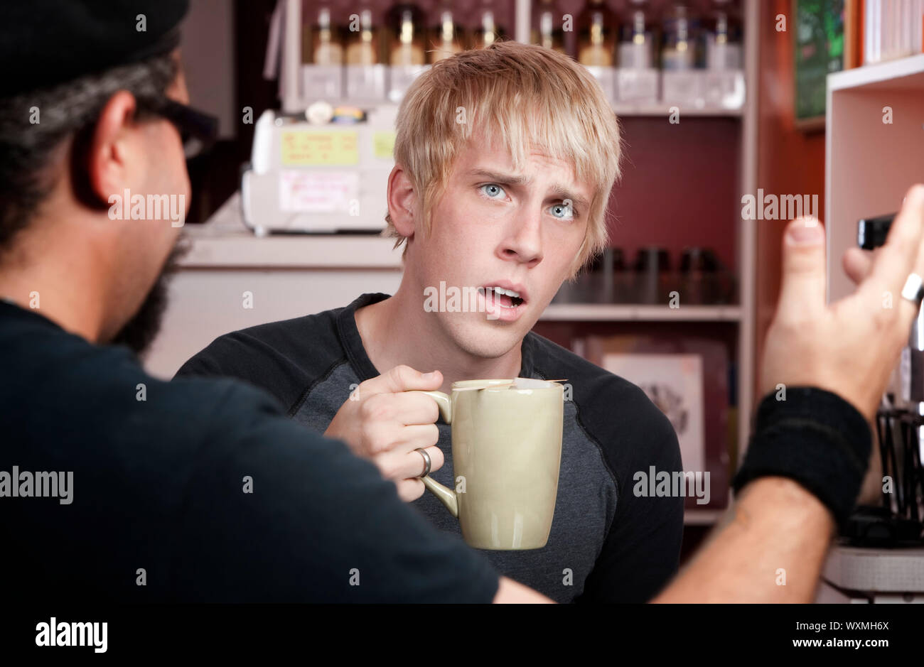 Shocked young adult man reacting hi-res stock photography and images ...