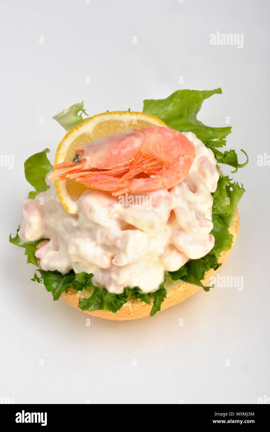 some fresh king prawns on bread roll Stock Photo - Alamy