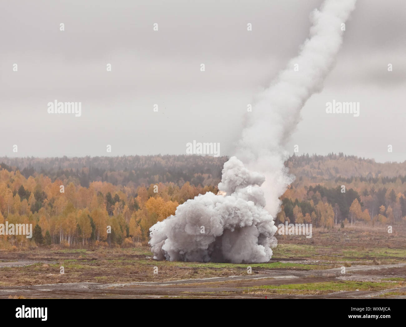 falling smoke trail in the sky and the explosion on the ground Stock ...
