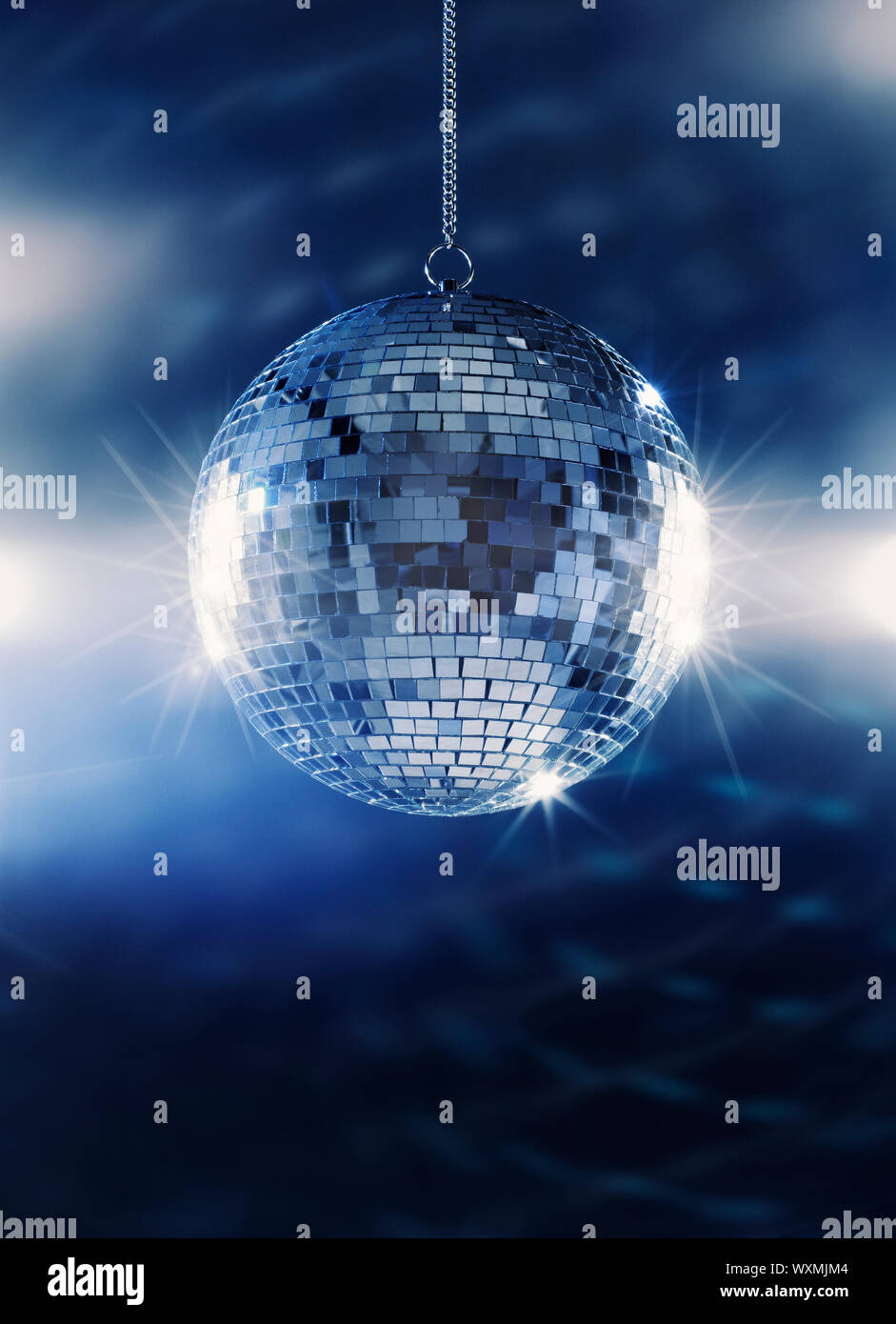 A Shiny mirror ball hanging from the ceiling Stock Photo - Alamy