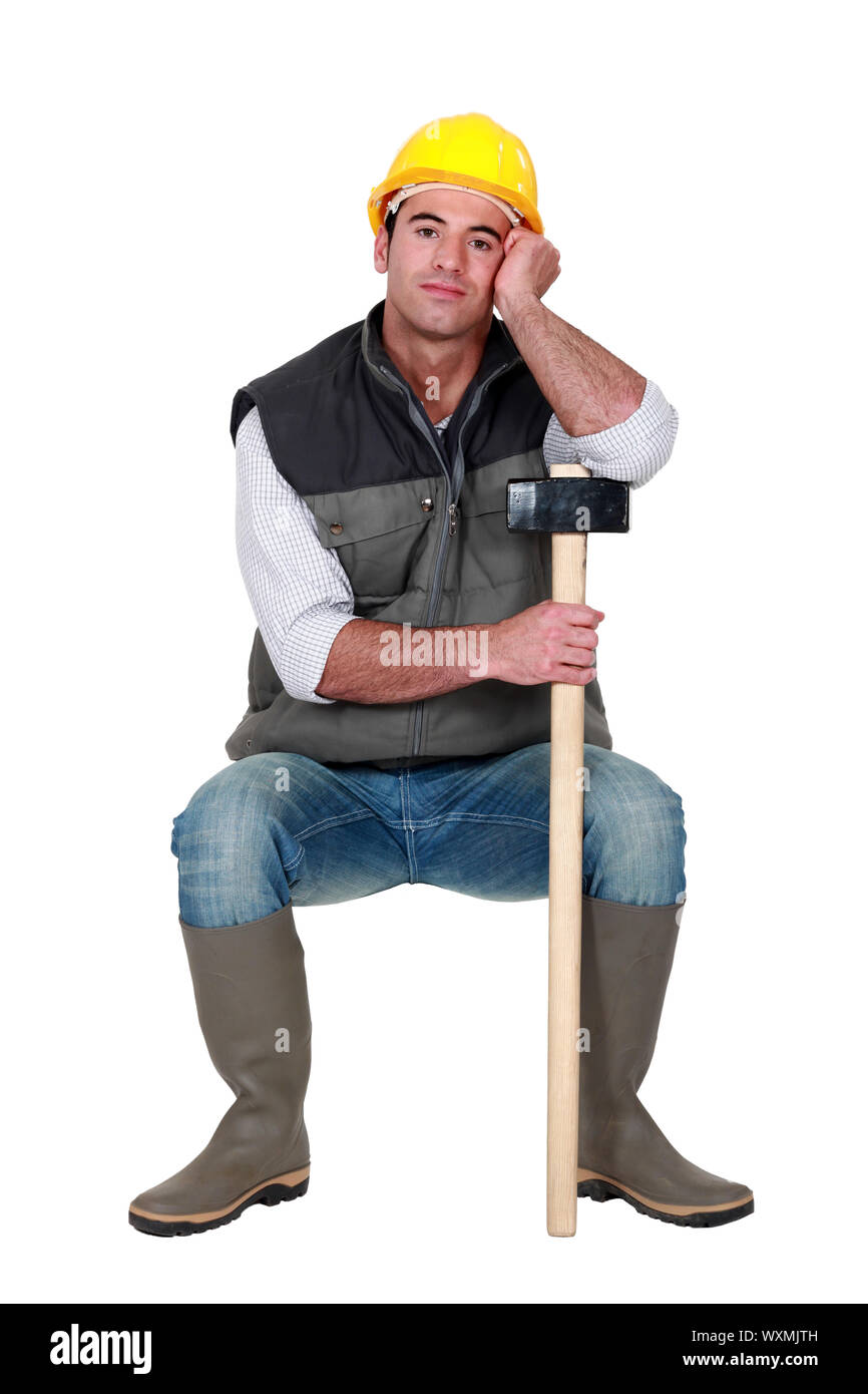 Construction worker with a sledgehammer Stock Photo - Alamy