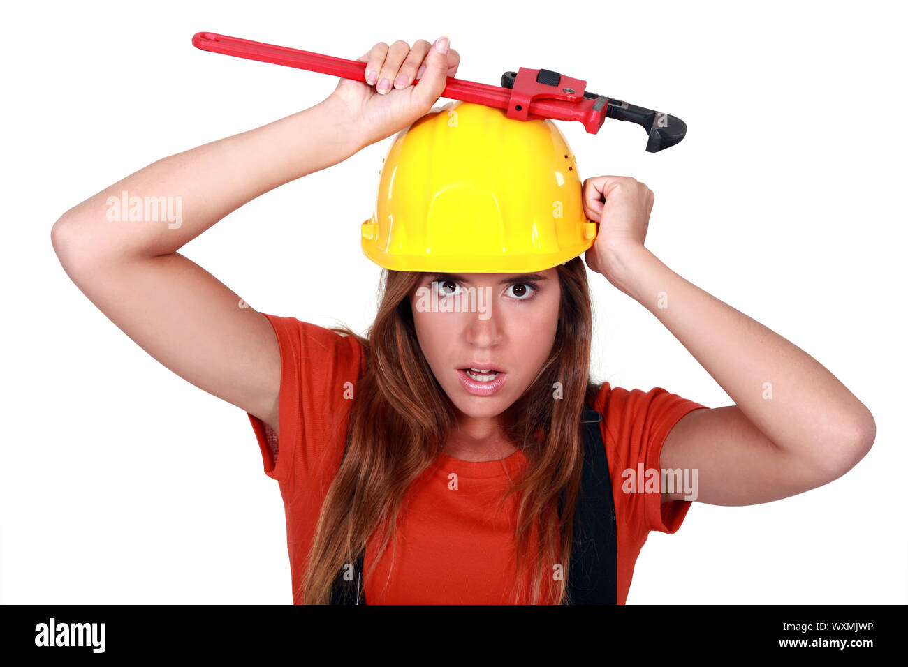 A female manual worker with a wrench Stock Photo - Alamy