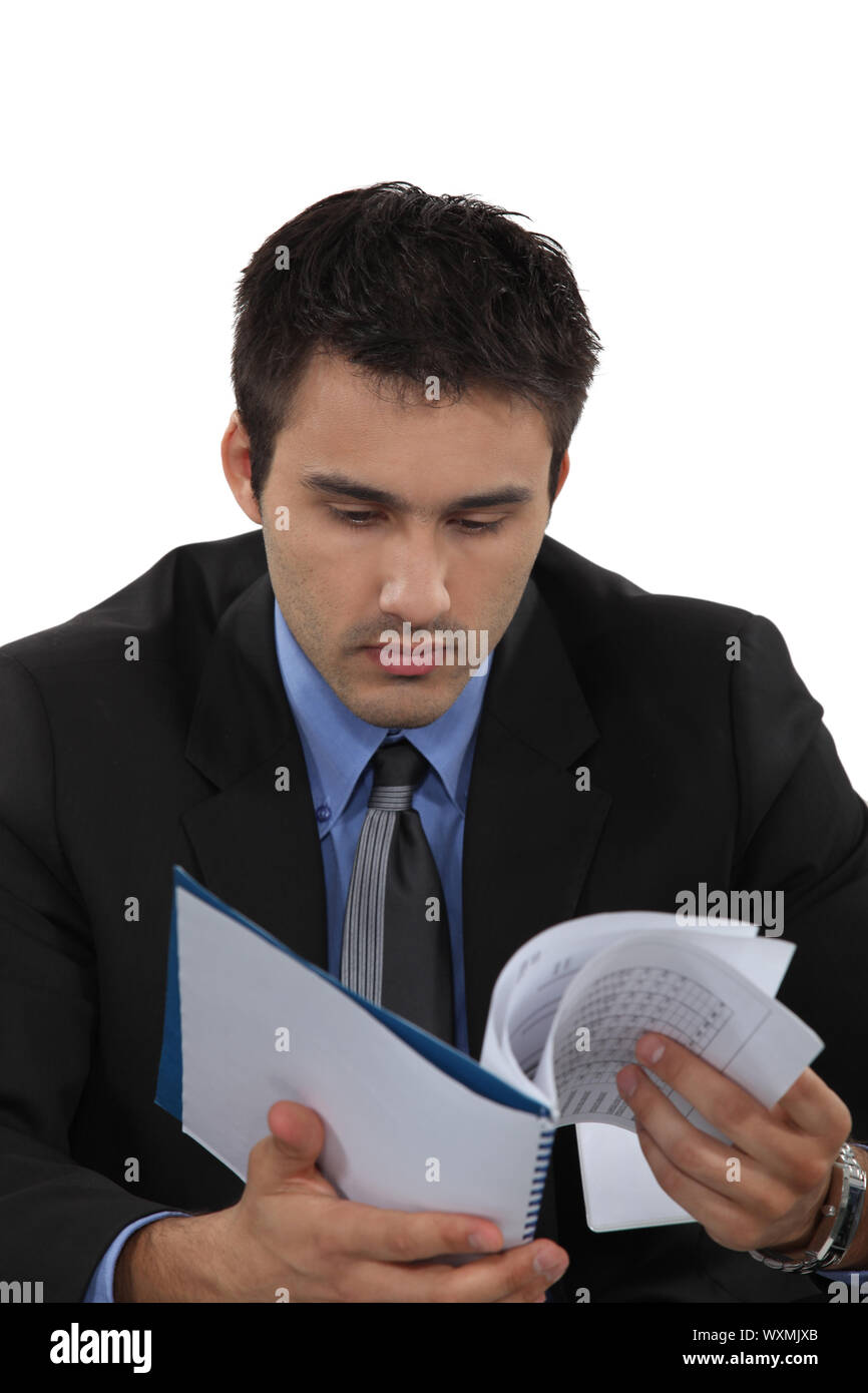 A businessman reading notes Stock Photo - Alamy