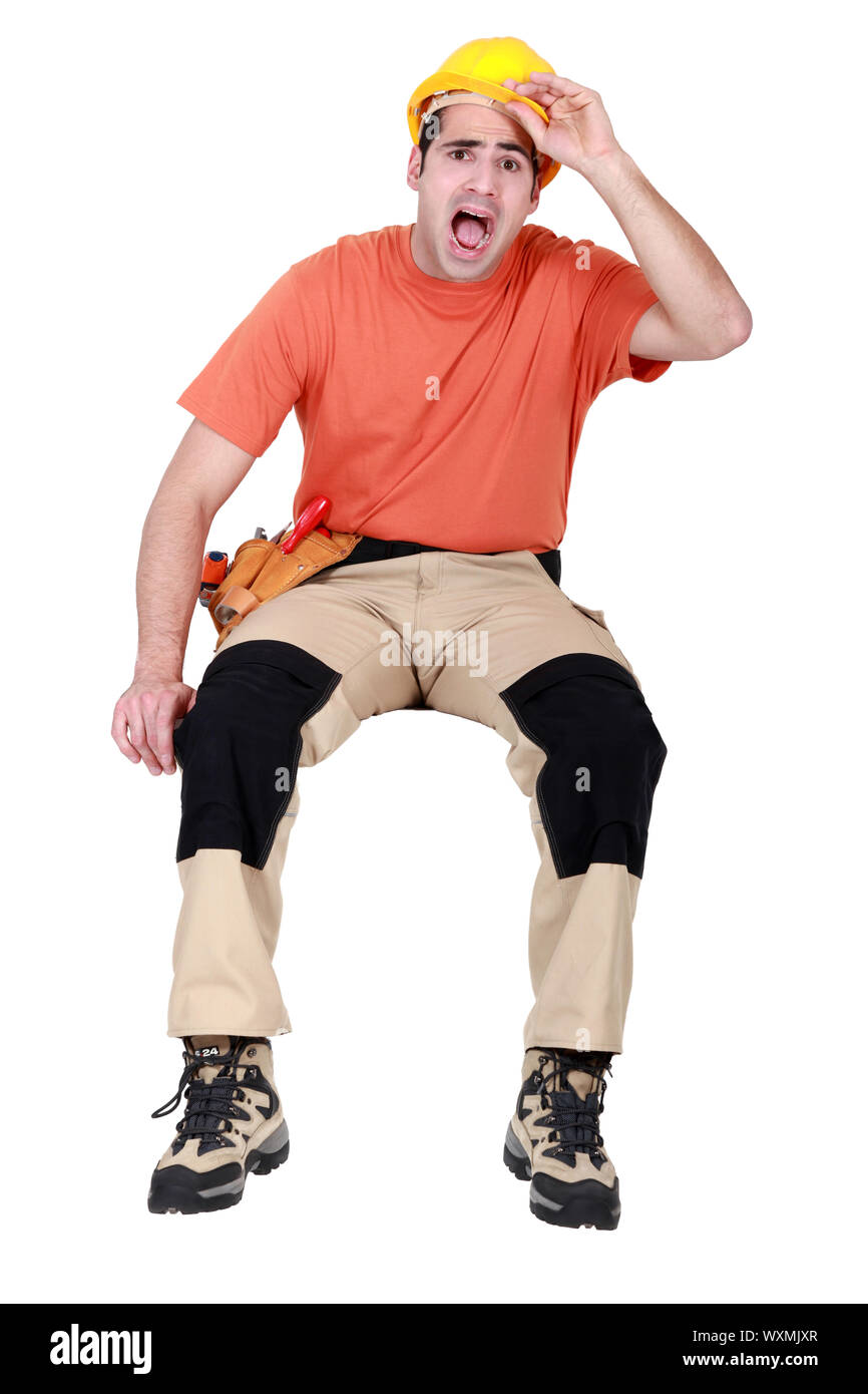 Shocked construction worker Stock Photo - Alamy