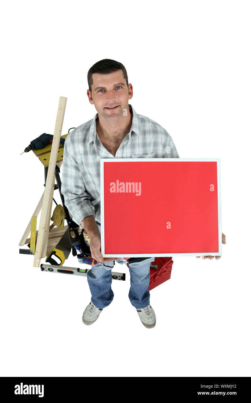 Carpenter posing with a picture frame Stock Photo - Alamy
