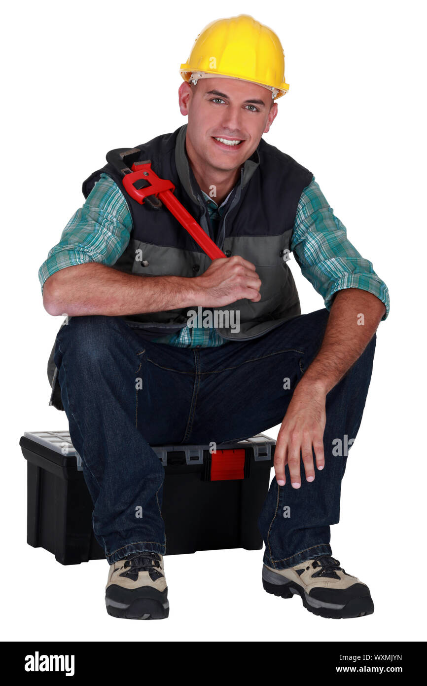 craftsman sitting on his toolbox Stock Photo - Alamy