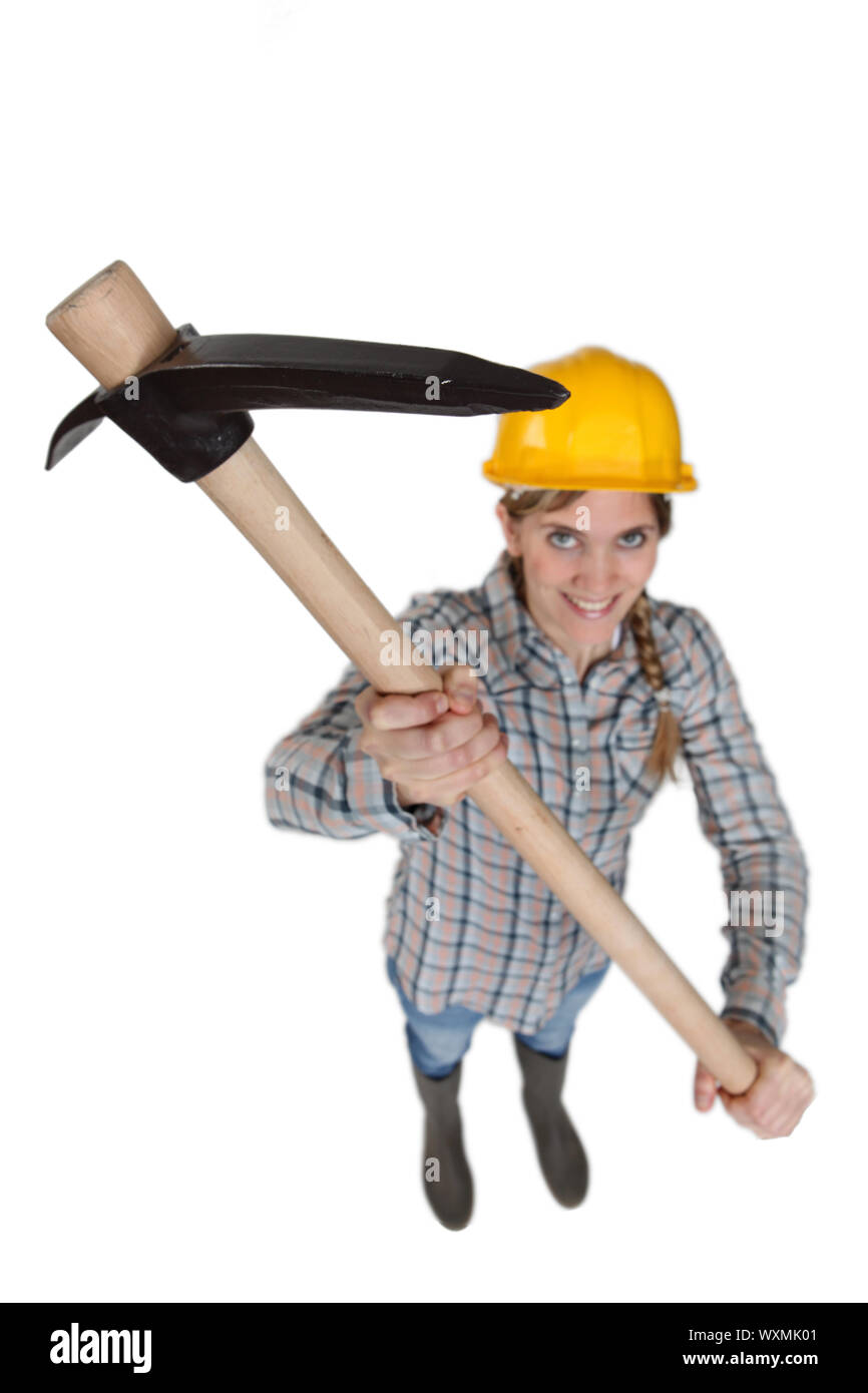 Woman holding pickaxe Stock Photo - Alamy