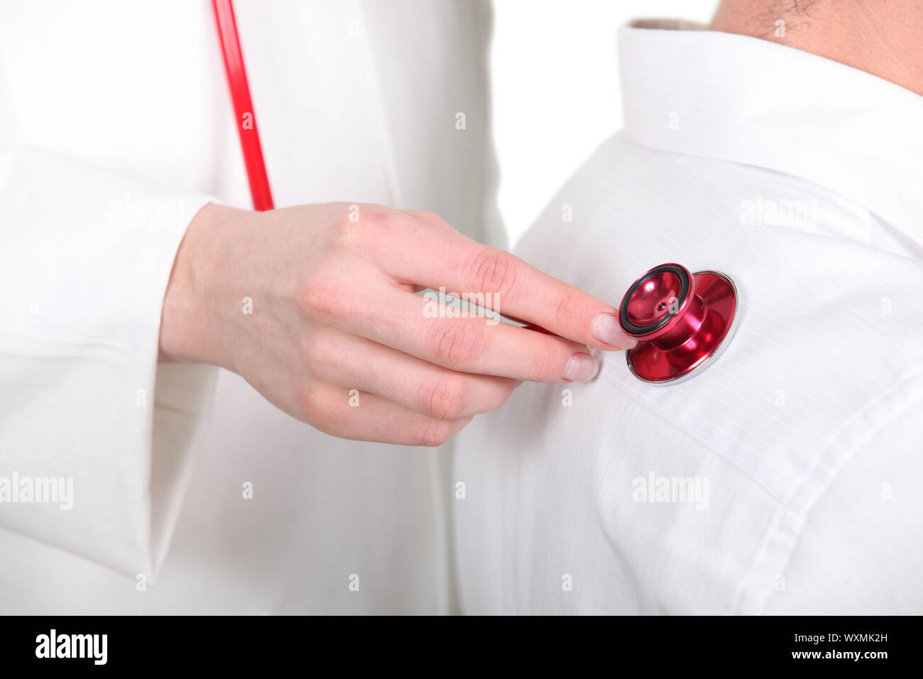 Doctor putting stethoscope on patients back Stock Photo - Alamy
