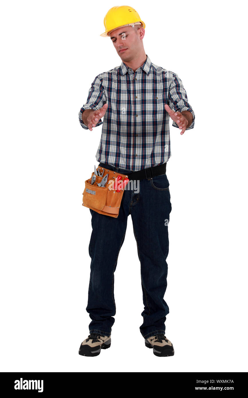 Tradesman holding an invisible object Stock Photo - Alamy