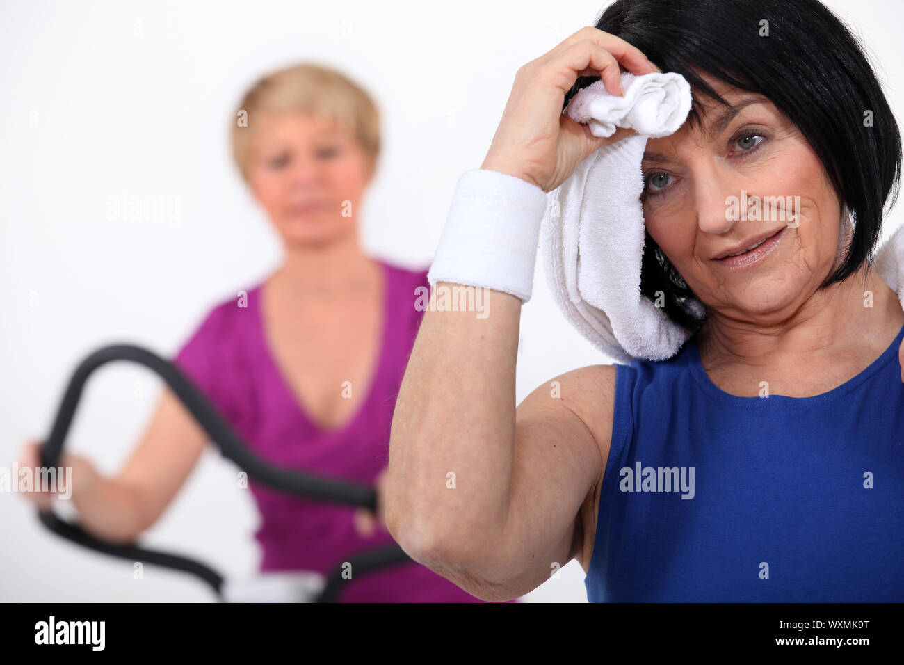 Two women sweating at the gym Stock Photo - Alamy