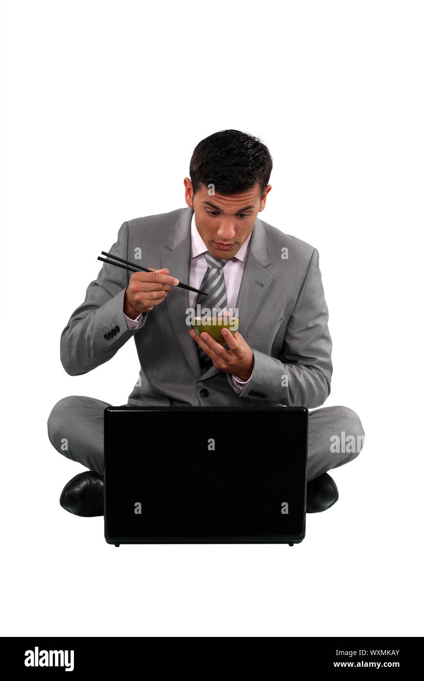 Man eating with chopsticks Stock Photo - Alamy