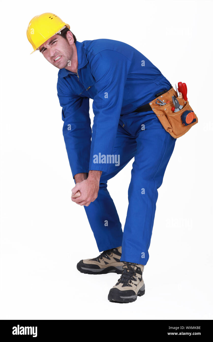 Struggling manual worker Stock Photo - Alamy