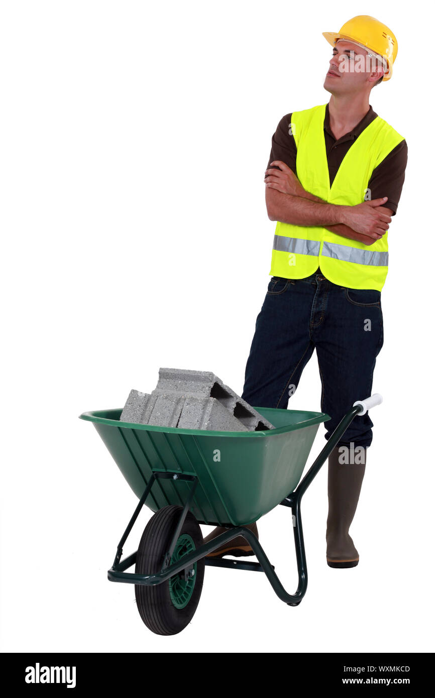 Construction worker works concrete Cut Out Stock Images & Pictures - Alamy