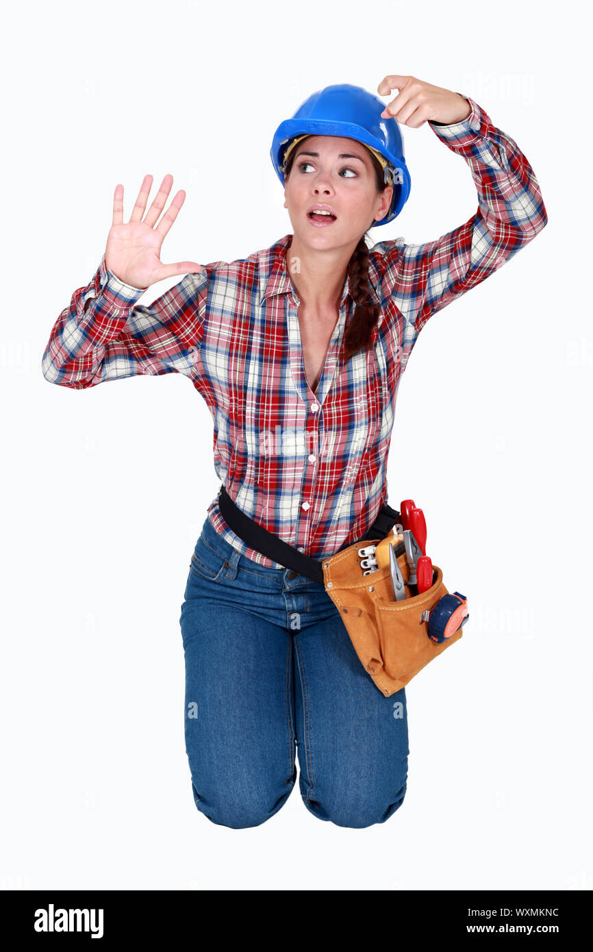 A female construction worker trapped in an invisible box Stock Photo ...