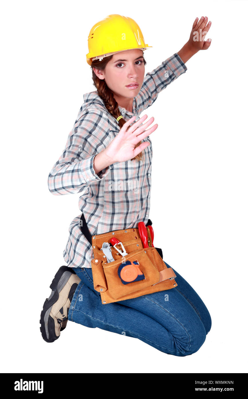 A female construction worker trapped in an invisible box Stock Photo ...