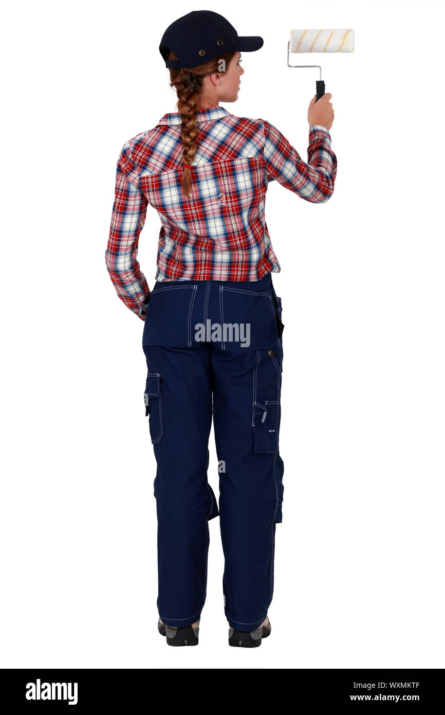 Female painter using roller Cut Out Stock Images & Pictures - Alamy
