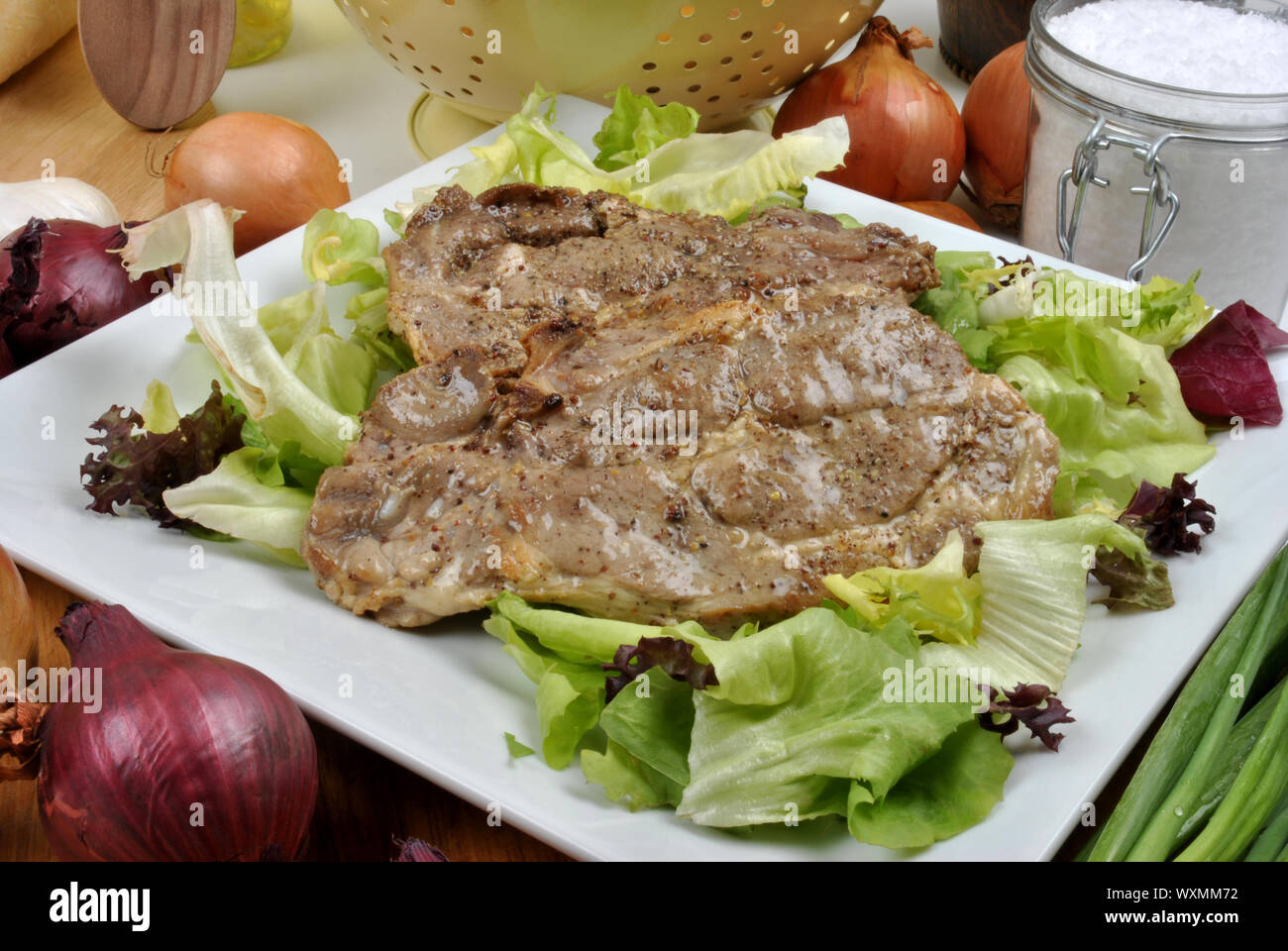 spare rib chops on a plate with salad Stock Photo - Alamy