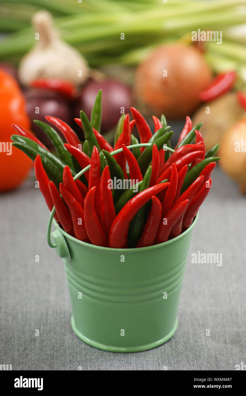 some red and green chili in a bucket Stock Photo - Alamy